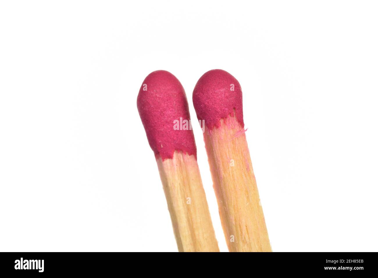 Two wooden matches, close-up, on a white background Stock Photo - Alamy