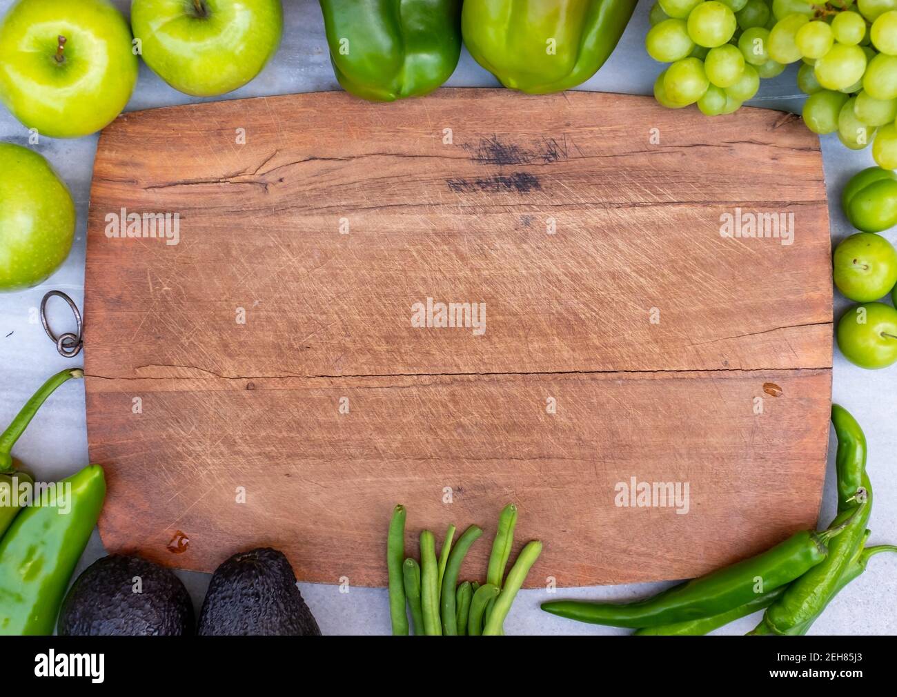 Wooden chopping board with vegetables in the frame Stock Photo - Alamy