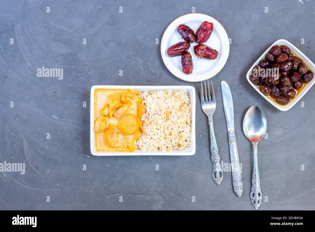Iftar Meal At Ramadan Curry And Salad And Dates Stock Photo Alamy