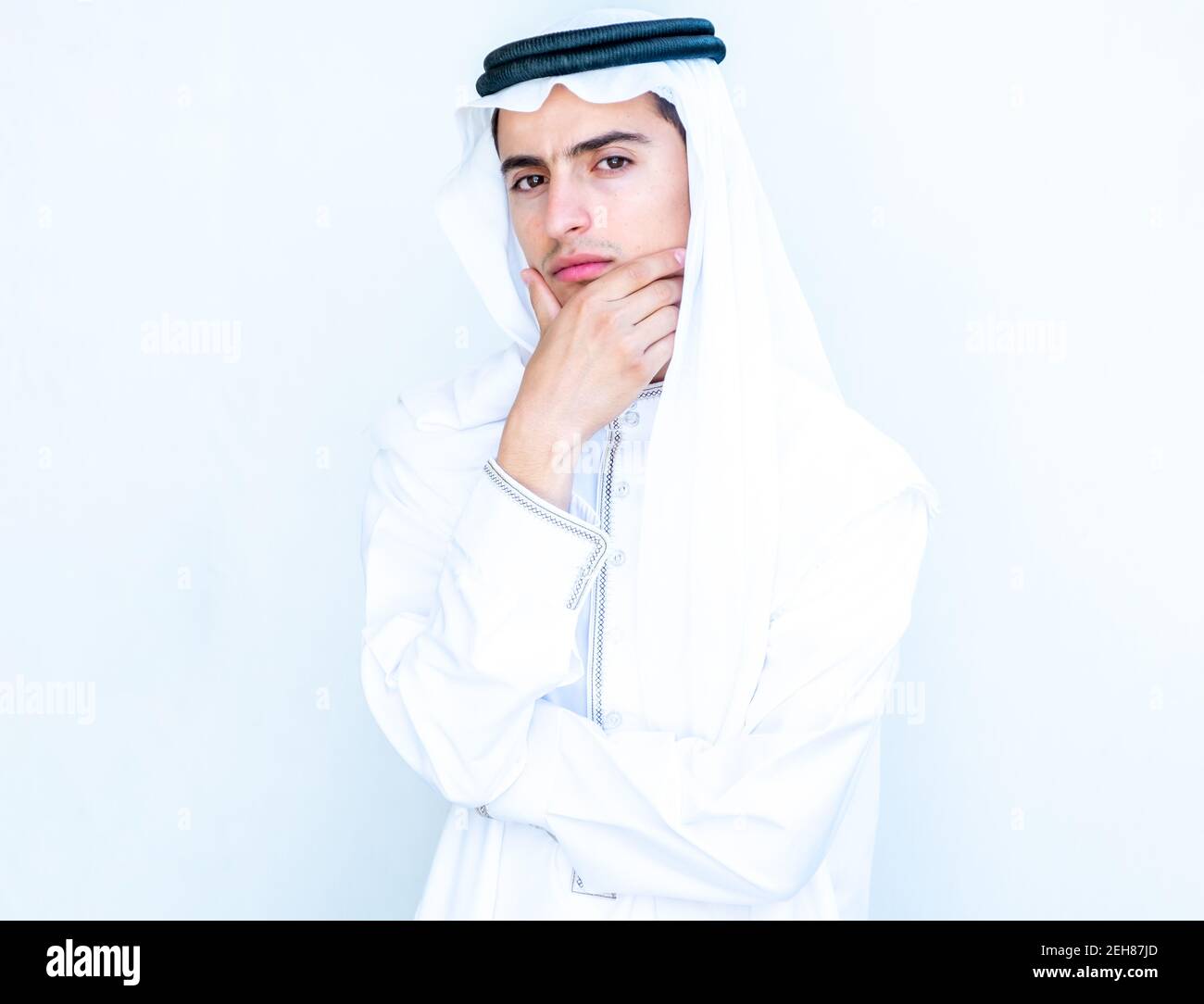 Arabic guy thinking about new things Stock Photo - Alamy