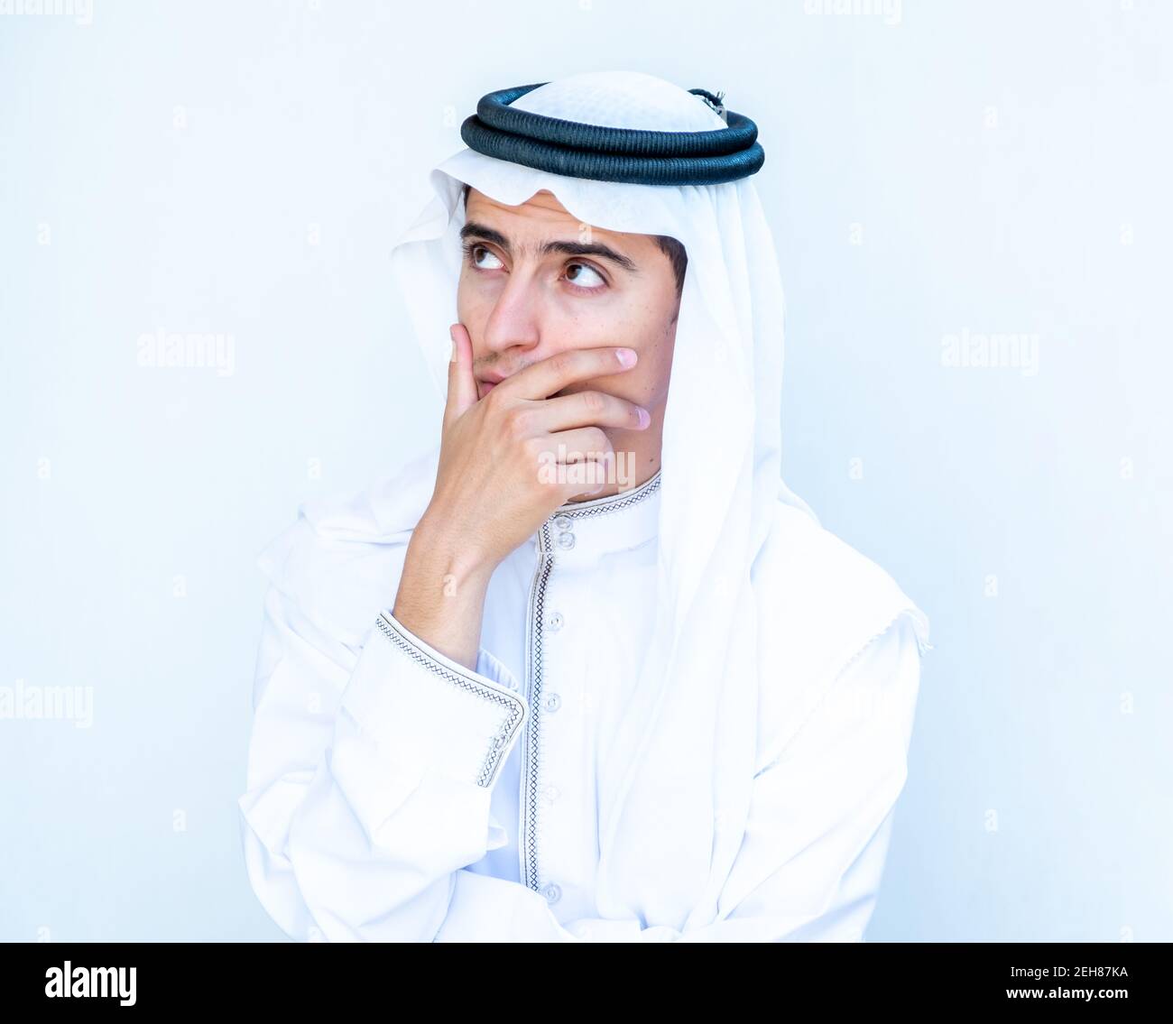 Arabic guy thinking about new things Stock Photo - Alamy