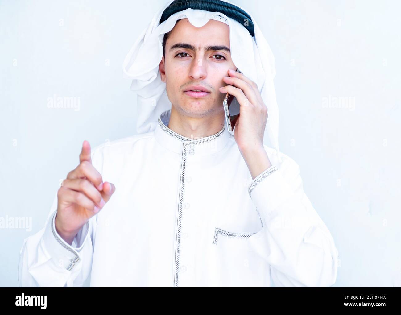 Arabic young businessman having phone call Stock Photo - Alamy