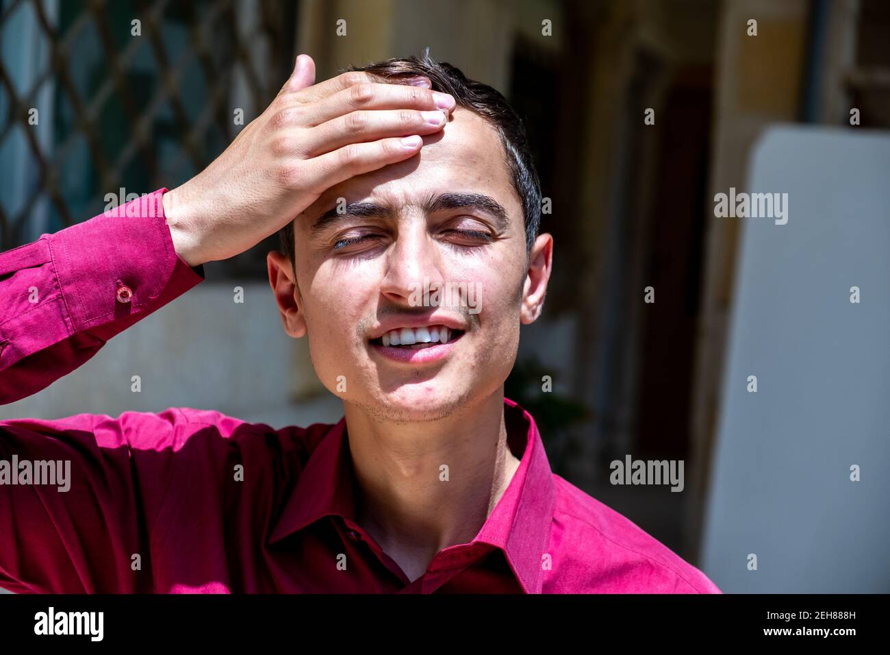 Handsome arabic guy feeling happy Stock Photo - Alamy