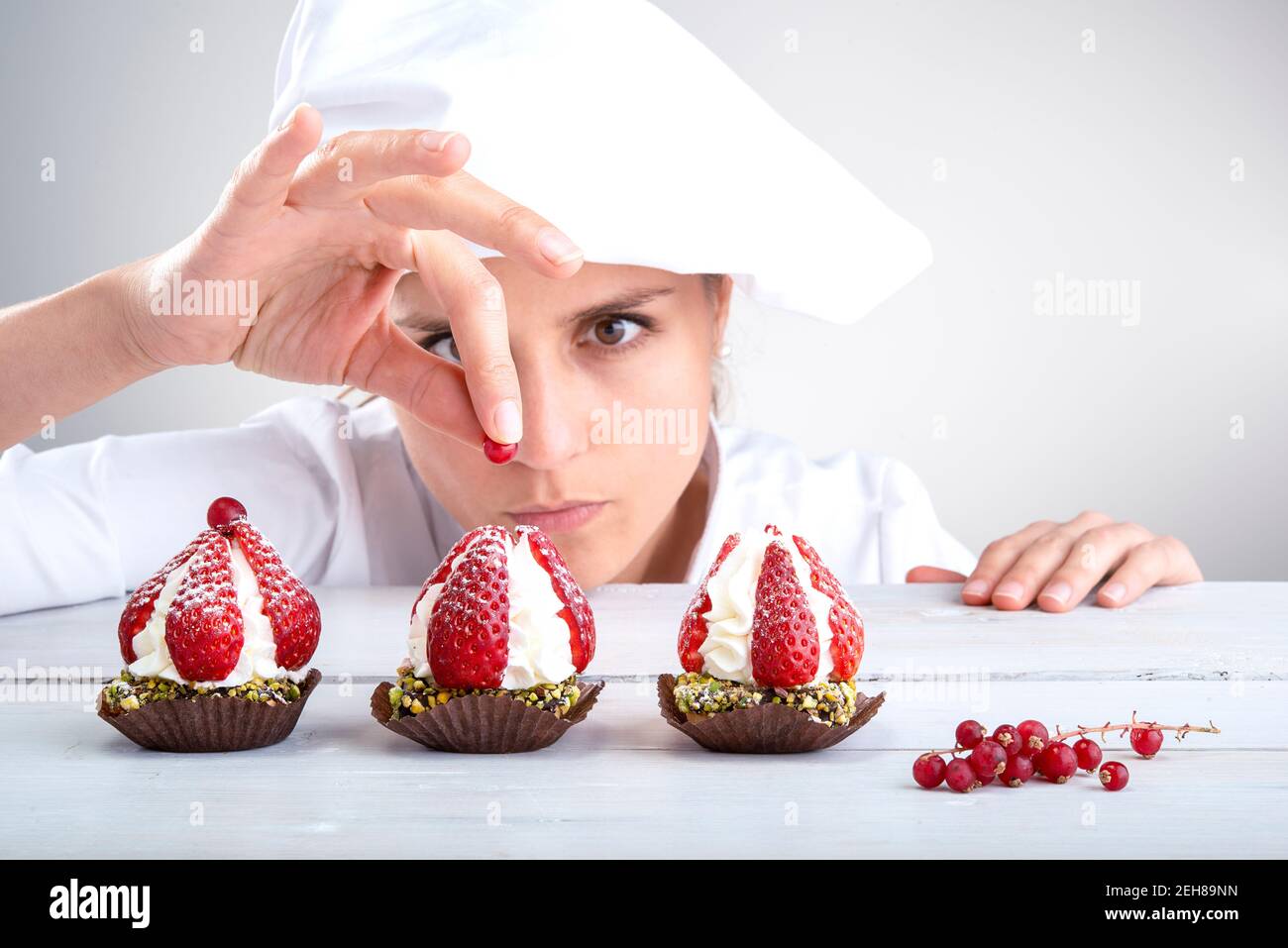 Professional confectioner cooking strawberry raspberry hi-res stock ...