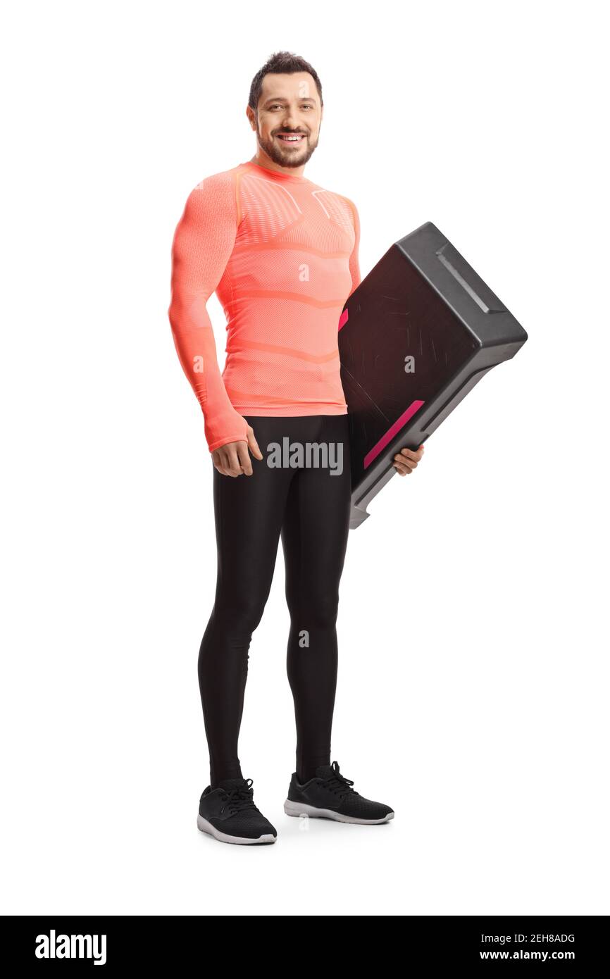 Full length portrait of a man hlding a step aerobic platform isolataed ...