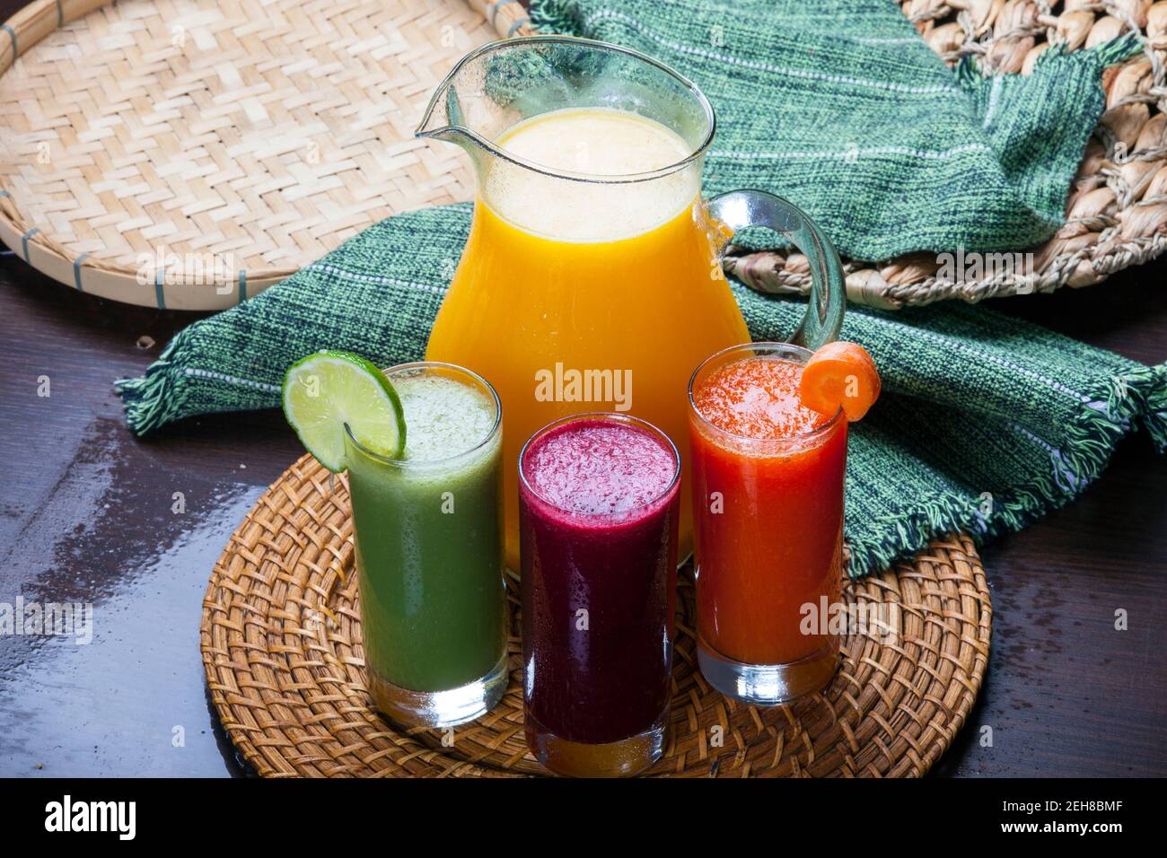 juice jar with glasses and assorted juices Stock Photo - Alamy