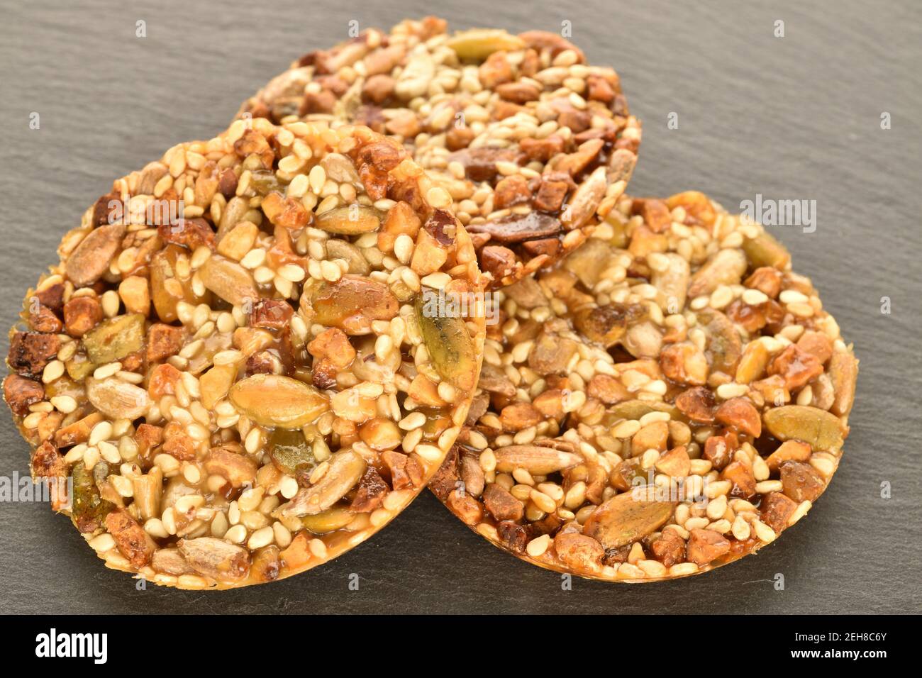 Three fresh flavored delicious sweet walnut cookies lie on a table made ...