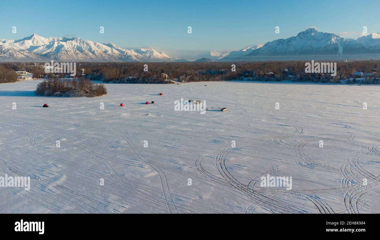 Ice fishing on Long Lake. Palmer, Alaska Stock Photo - Alamy