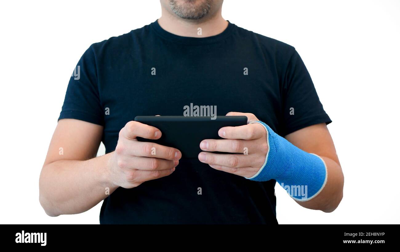 Fiberglass cast hand play phone on white background Stock Photo - Alamy