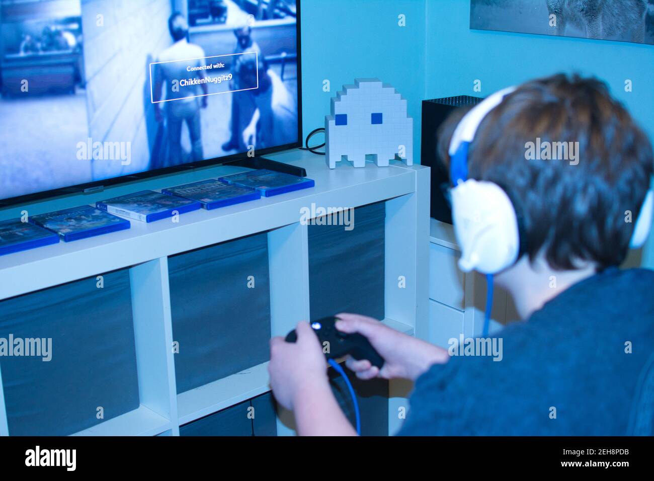 Teenage boy playing new Xbox console Stock Photo - Alamy