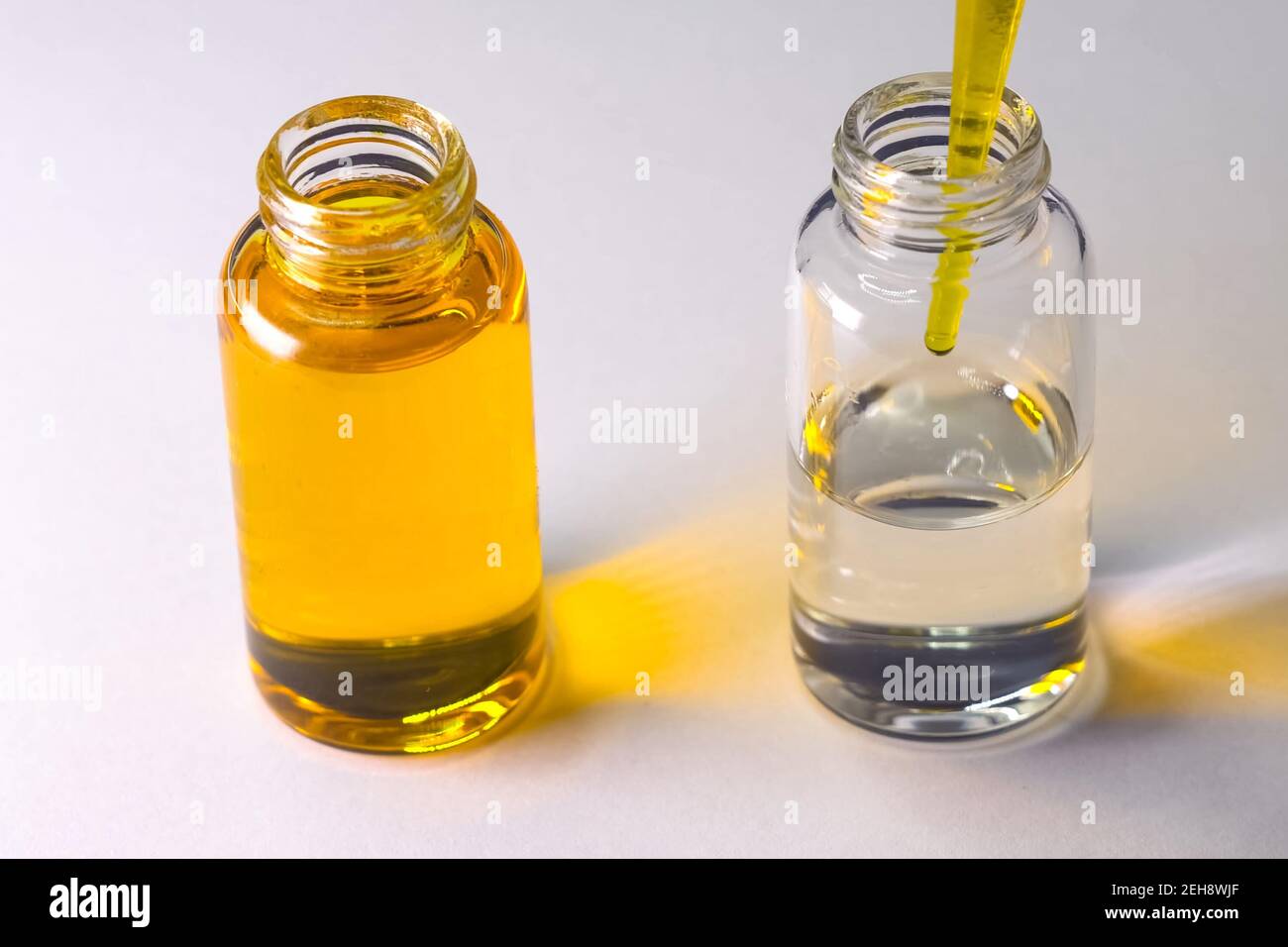 two test tubes in the lab. Pipet in a test tube Stock Photo - Alamy