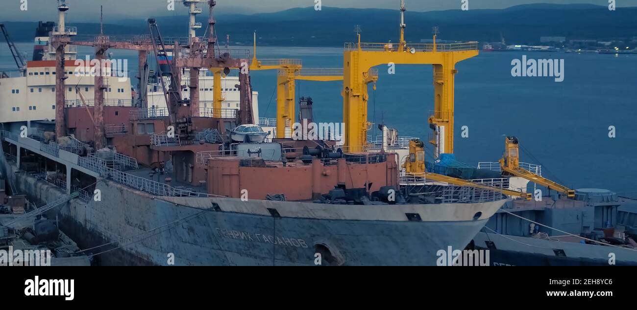Auxiliary cargo ship in the industrial port Stock Photo - Alamy