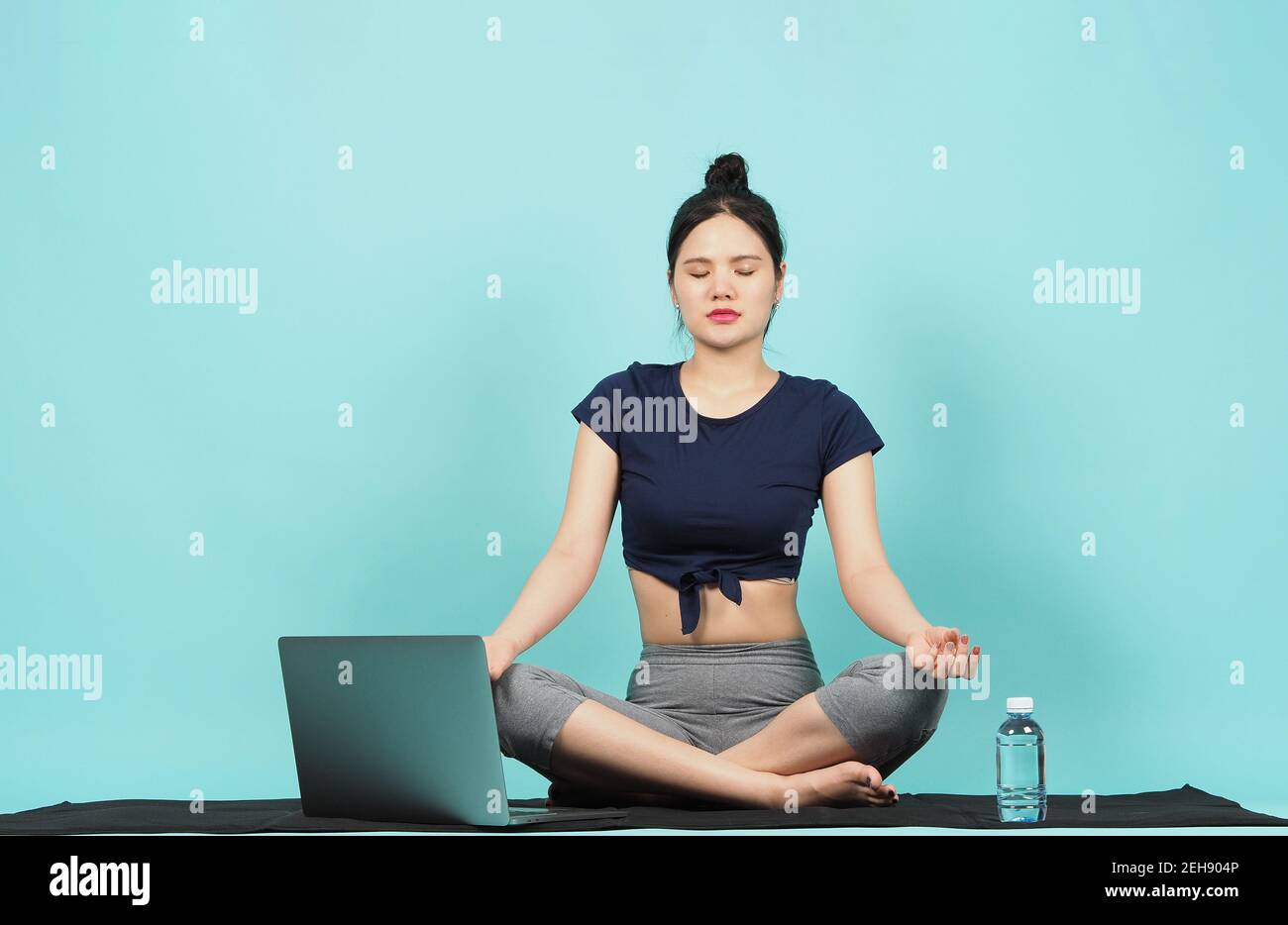 Fitness influencer. Sporty woman workout training online via laptop ...