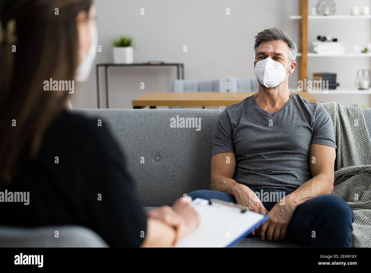 Psychiatrist Or Psychology Psychologist With Clipboard And Face Mask ...