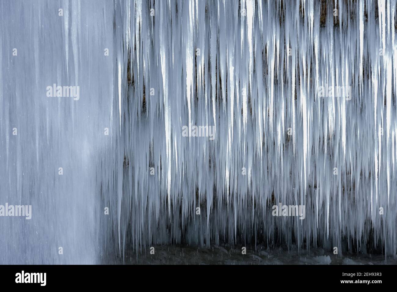 Waterfall crashing down frozen cave hi-res stock photography and images ...