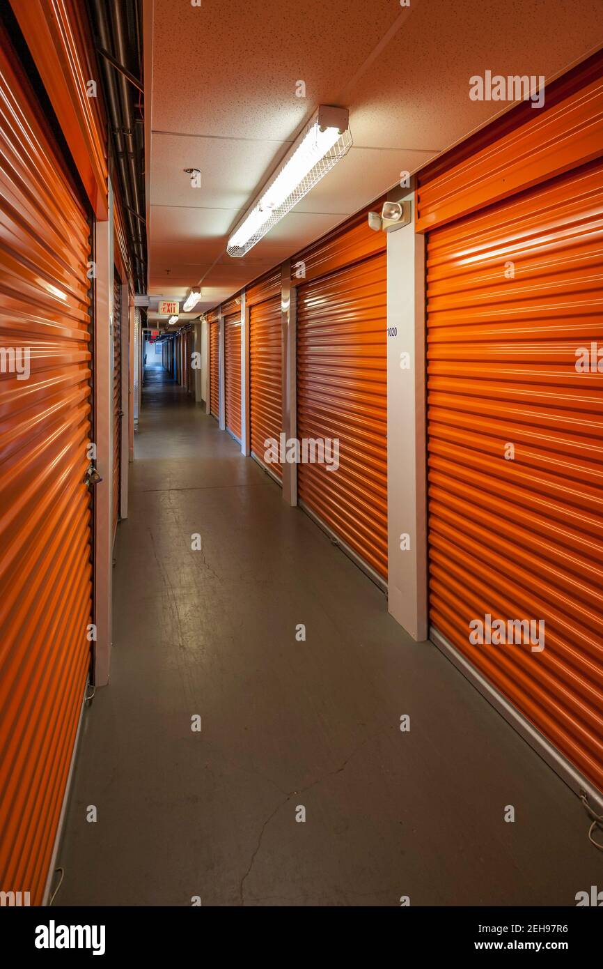 Orange interior of self storage units at an enclosed mini warehouse ...