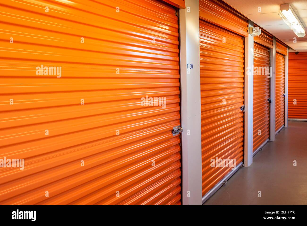 Orange interior of self storage units at an enclosed mini warehouse ...