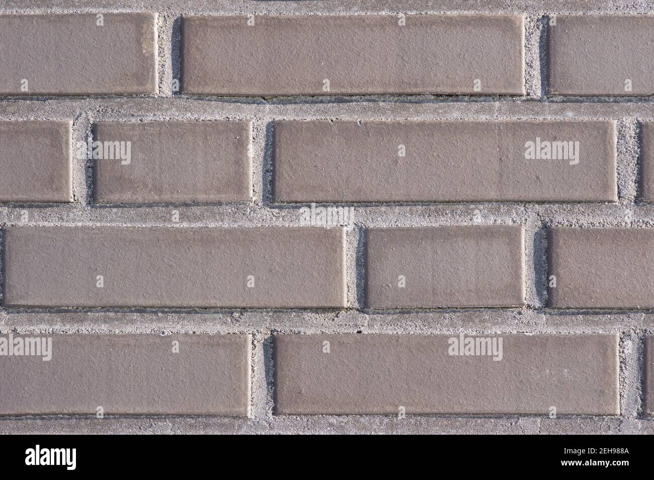 Gray stone brick wall pattern background Stock Photo - Alamy