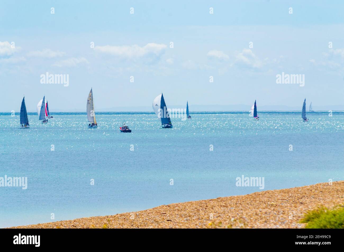Sailing yachts racing at Sandwich Bay-a long sweeping inlet of sea ...