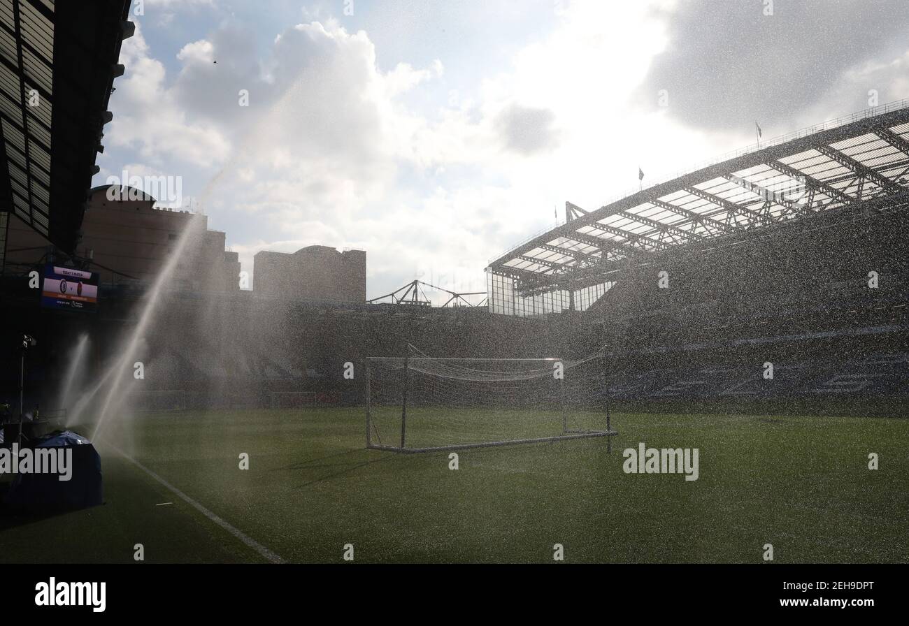 Sprinklers water the pitch before the match hi-res stock photography ...