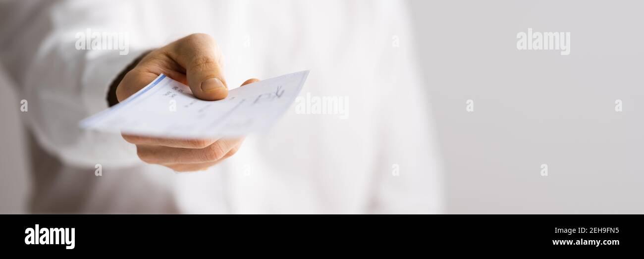 Giving Paycheck Or Payroll Cheque. Rent Check Pay Stock Photo - Alamy