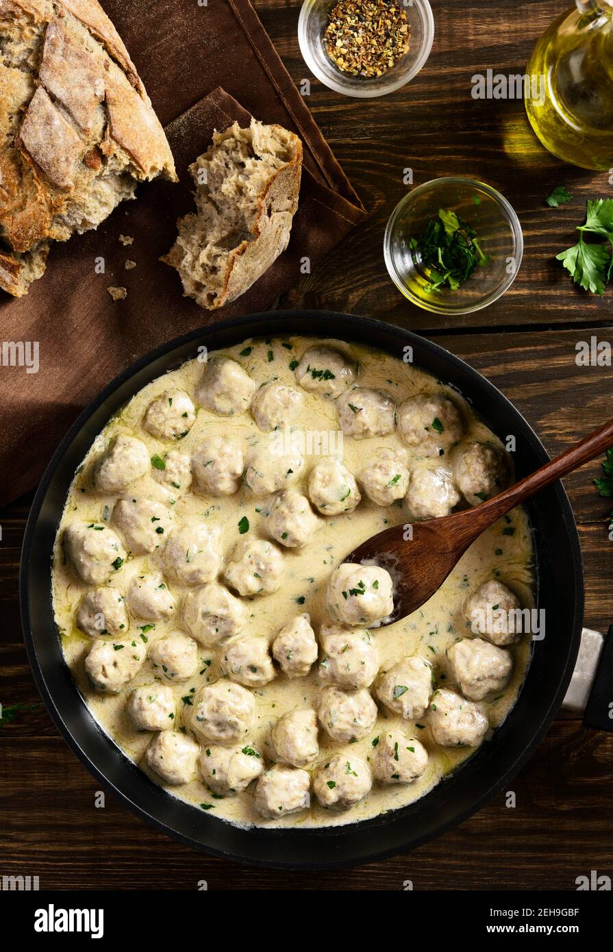 Delicious homemade swedish meatballs with creamy white sauce in frying ...