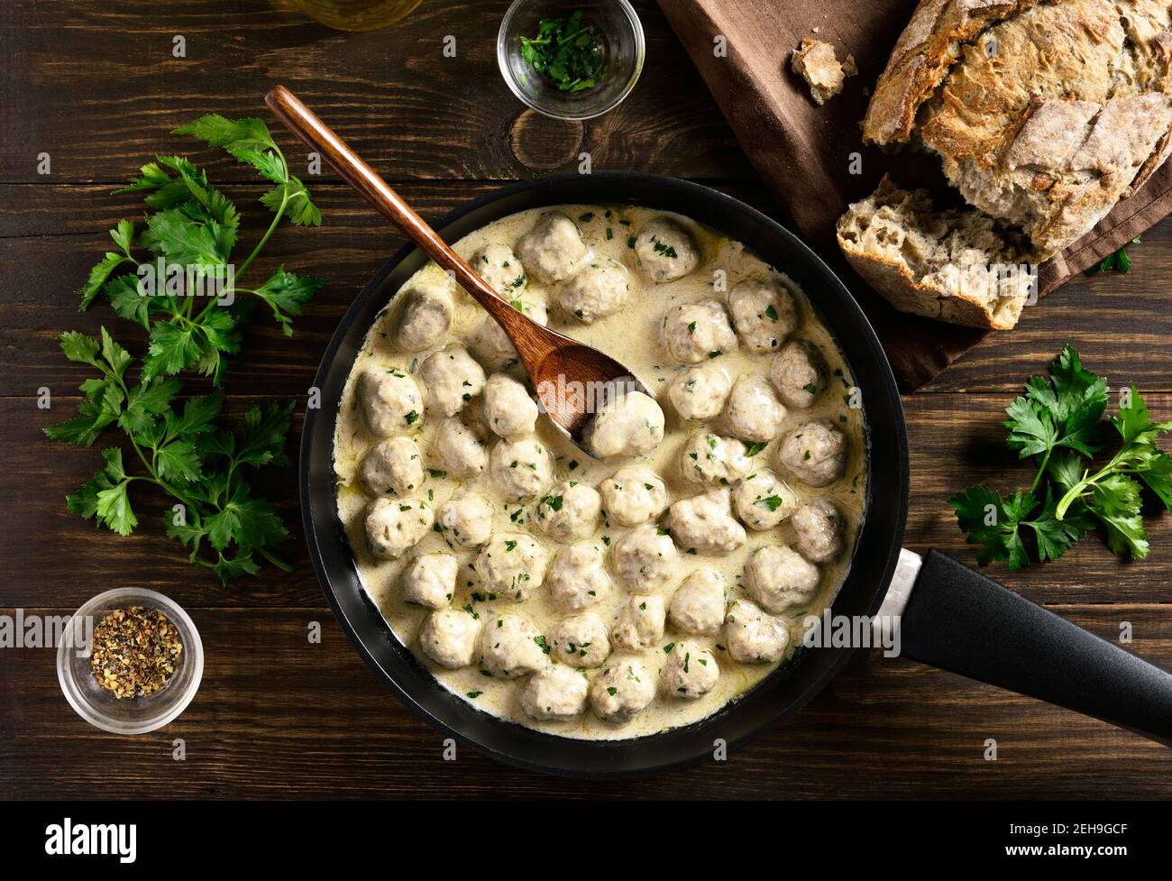Homemade swedish meatballs with creamy white sauce in frying pan over ...