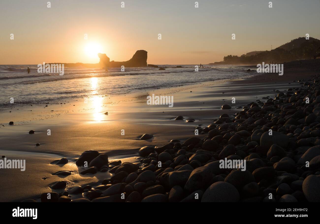 El Salvador El Tunco Silhouette of a man, his dog, and the large pig ...