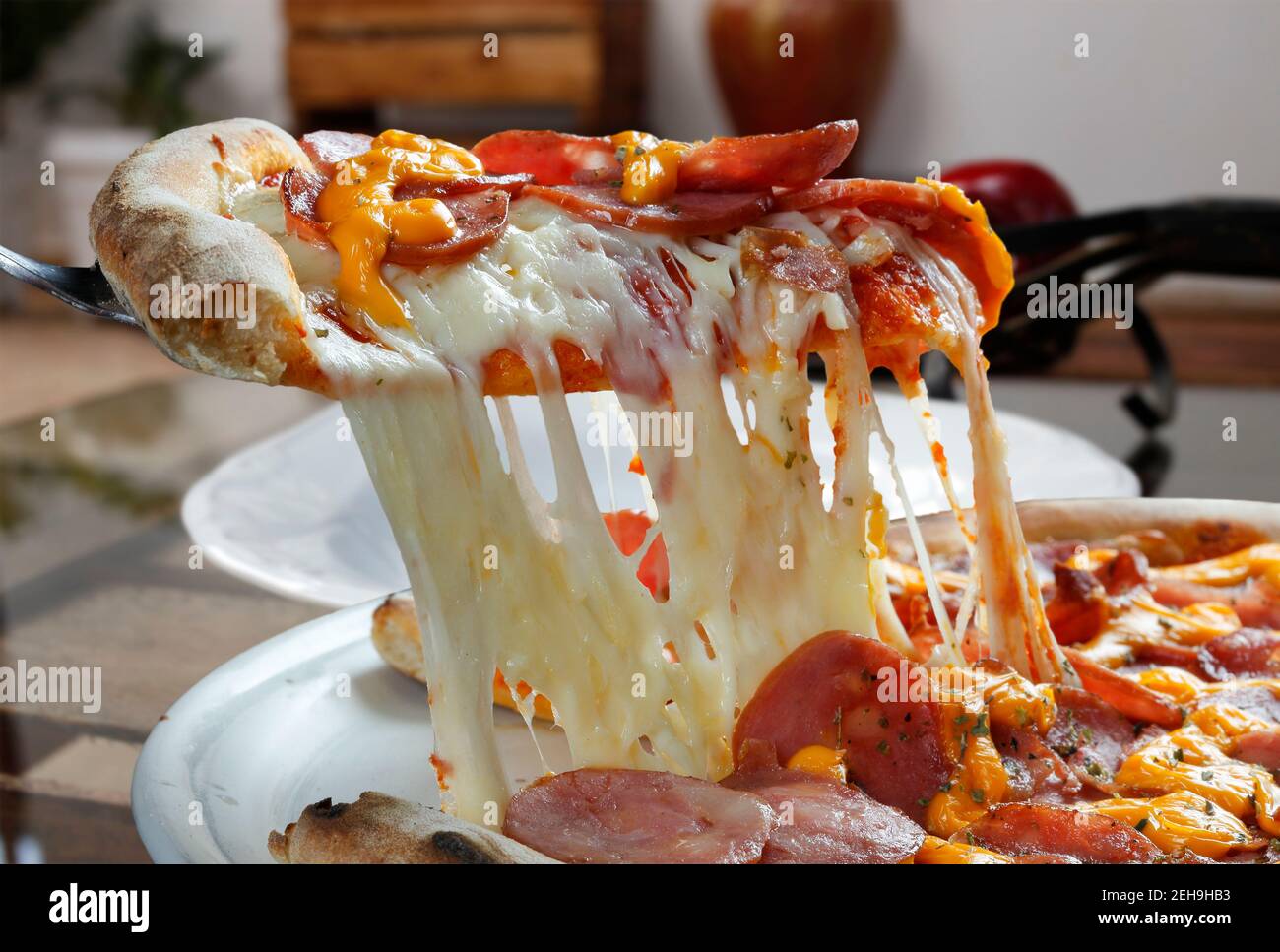 Pizza slice melted cheese food Stock Photo - Alamy