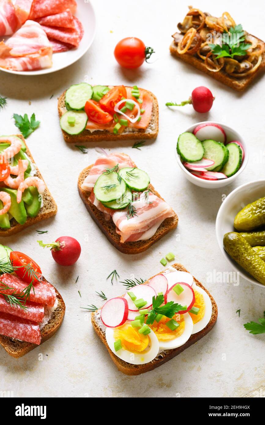 Open faced sandwiches with meat, vegetables, seafood. Assortment open ...