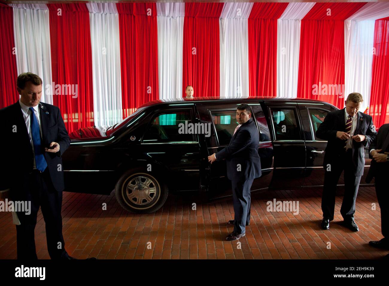 Trip Director Marvin Nicholson, left, and others wait for President ...