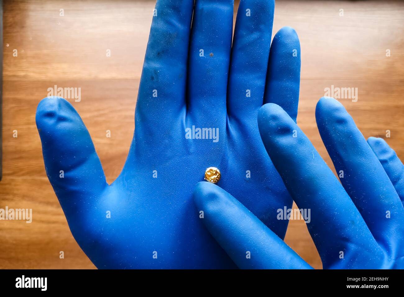 Gold nuggets black hands hi-res stock photography and images - Alamy