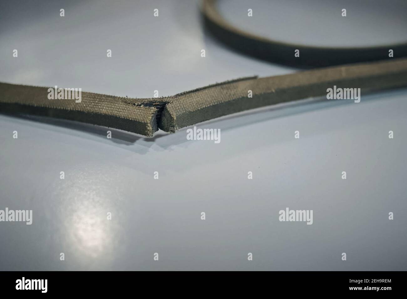 A torn rubber belt of belt transmission Stock Photo - Alamy