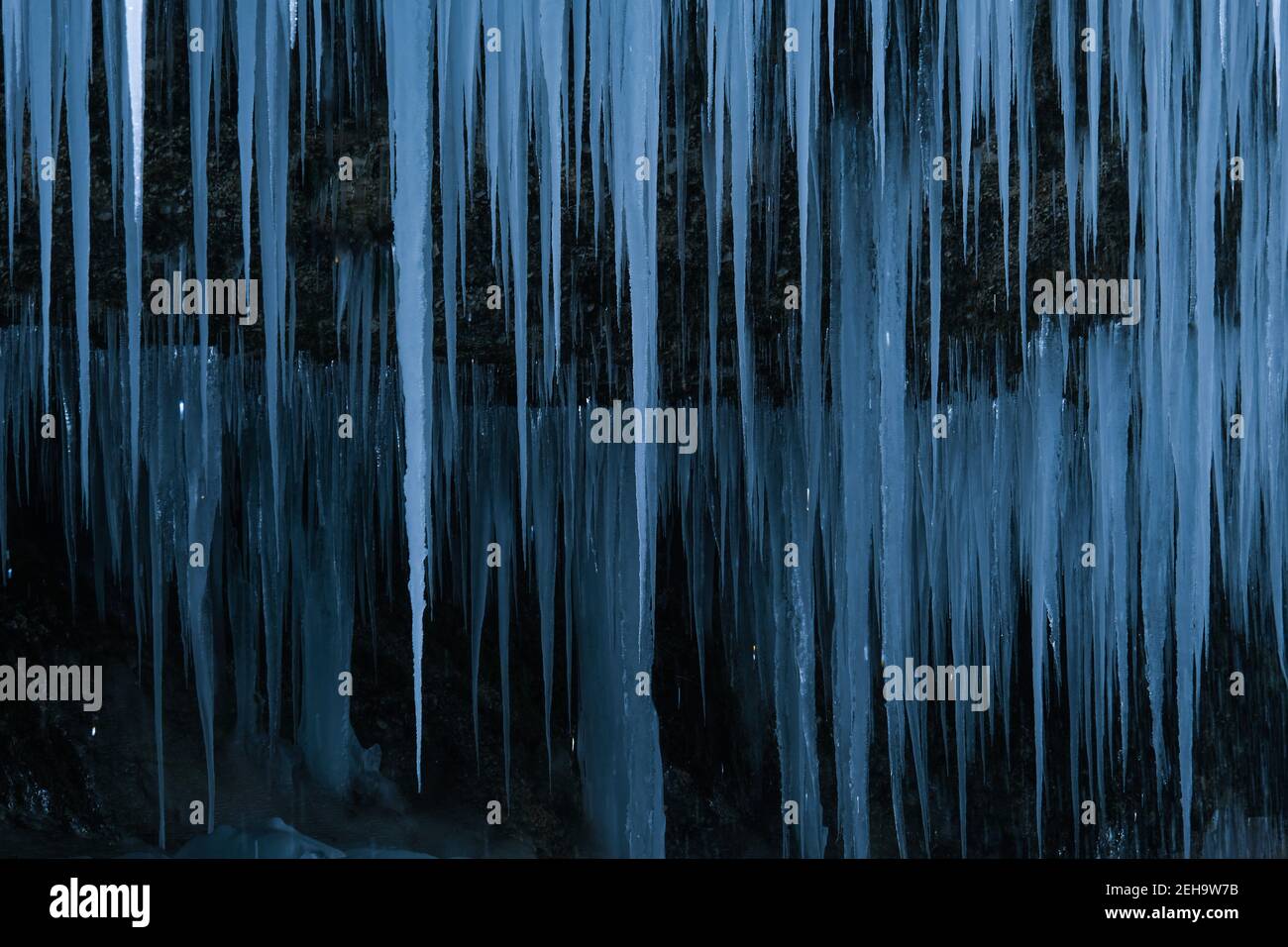 Waterfall crashing down frozen cave hi-res stock photography and images ...