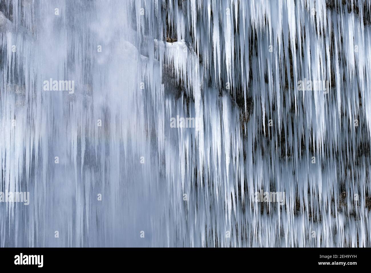 Waterfall crashing down frozen cave hi-res stock photography and images ...