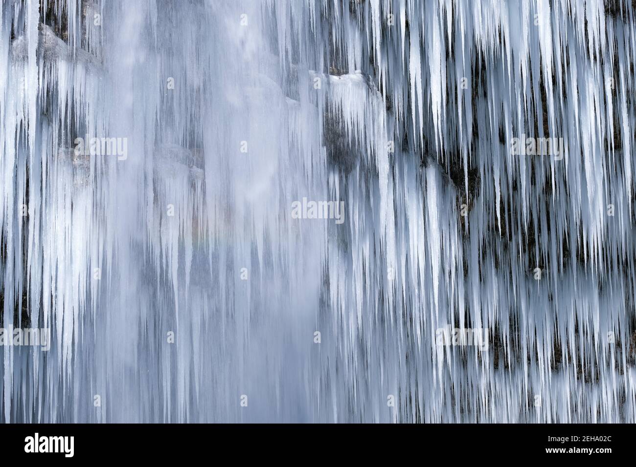 Waterfall crashing down frozen cave hi-res stock photography and images ...