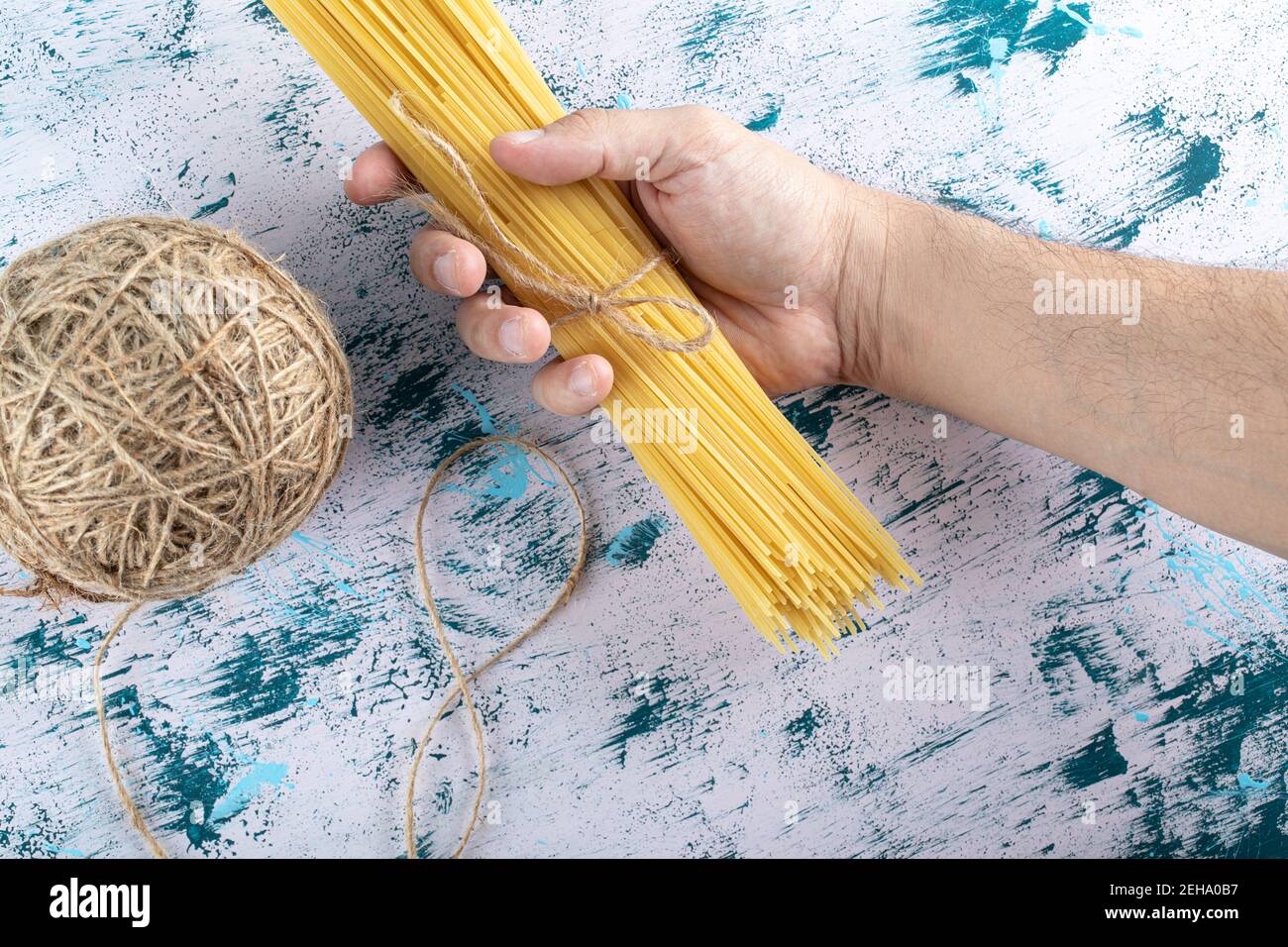 Hand with spaghetti hi-res stock photography and images - Alamy