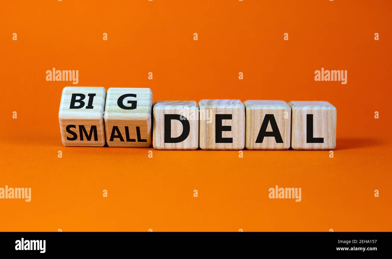 Big or small deal symbol. Turned wooden cubes and changed words 'small ...
