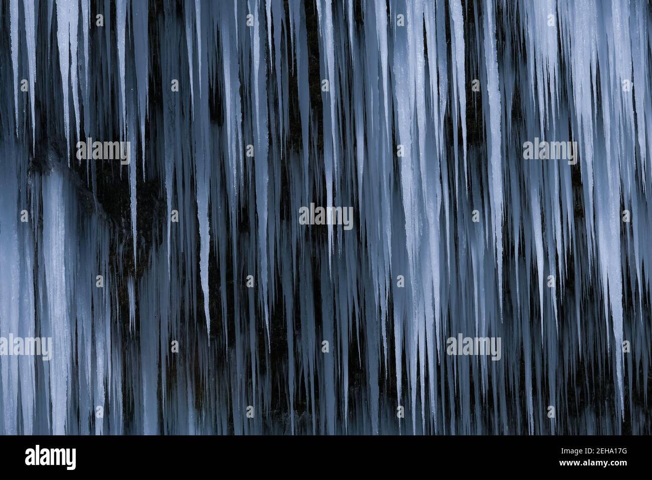 Waterfall crashing down frozen cave hi-res stock photography and images ...