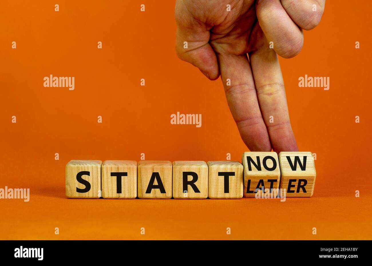 Start now or later symbol. Businessman turns wooden cubes and changes ...