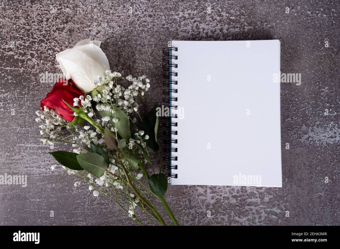 White and red rose with empty notepad mockup on old background, Mother ...