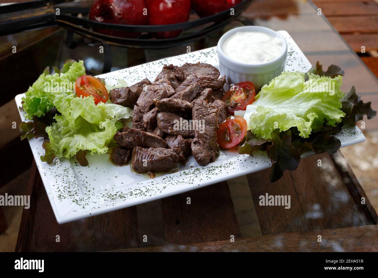 Filet mignon with salad and white sauce Stock Photo - Alamy