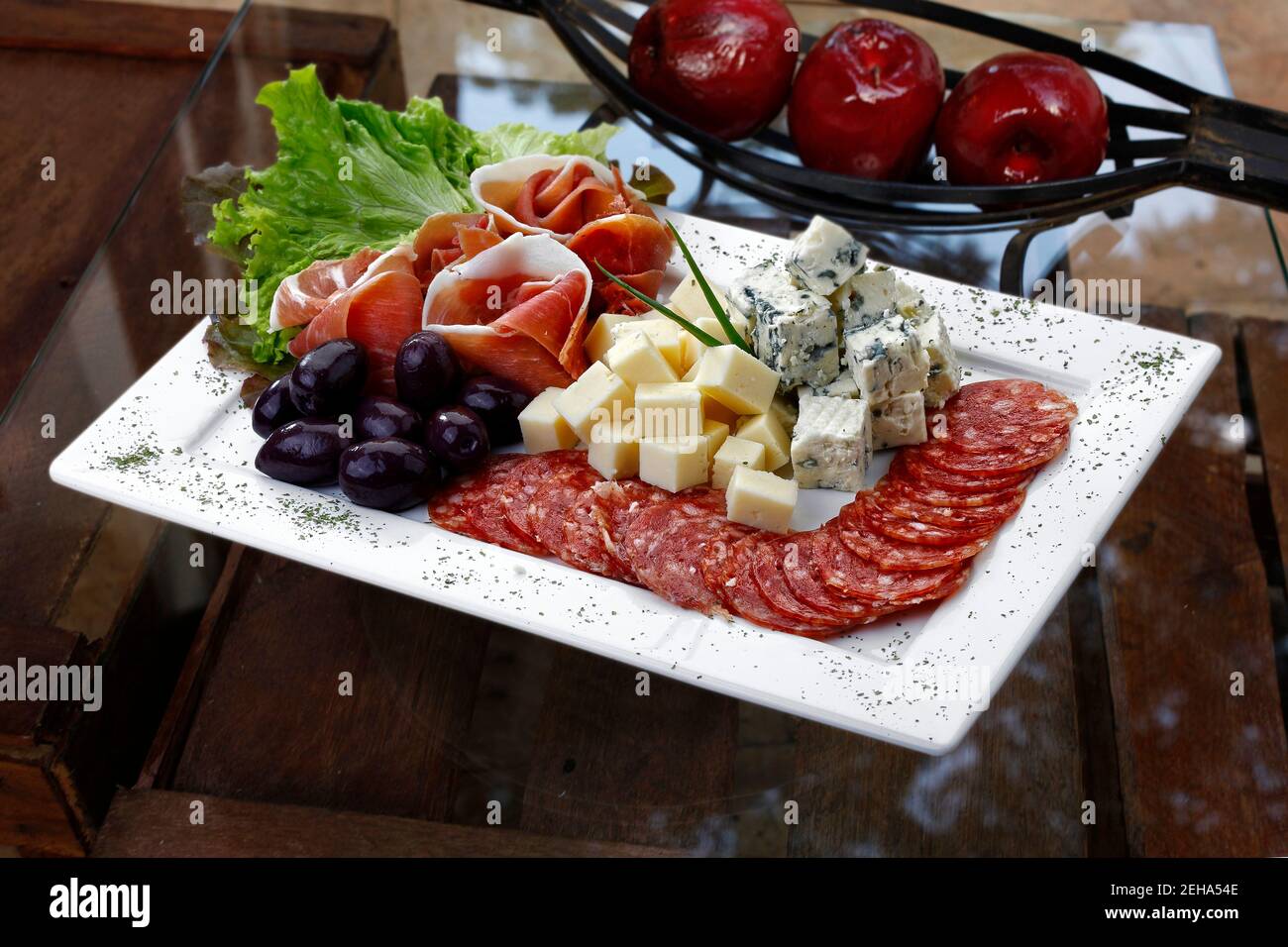 cold dish with cheese, pepperoni, olives, salad, parma ham, gorgonzola ...