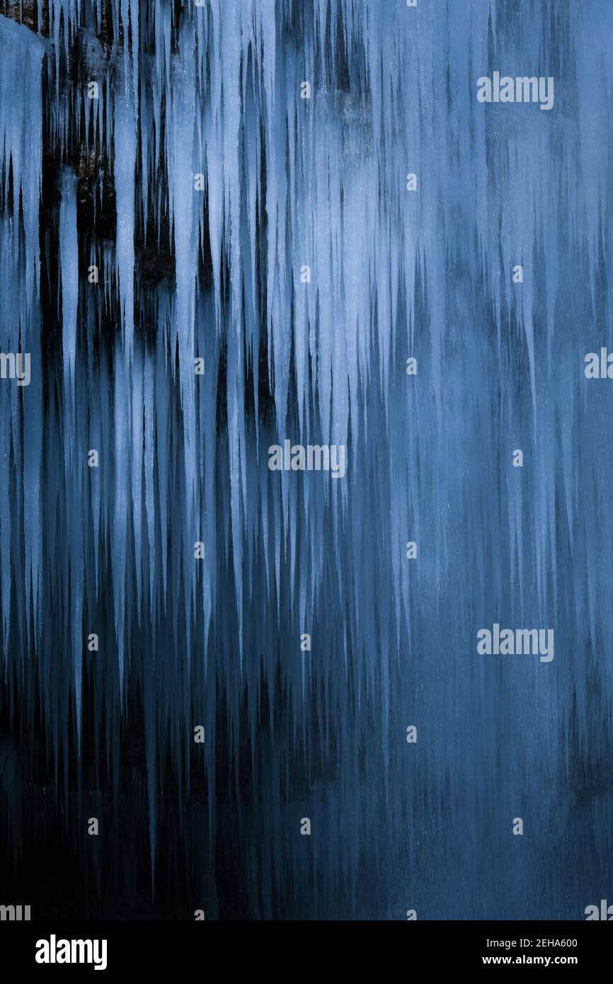 Waterfall crashing down frozen cave hi-res stock photography and images ...