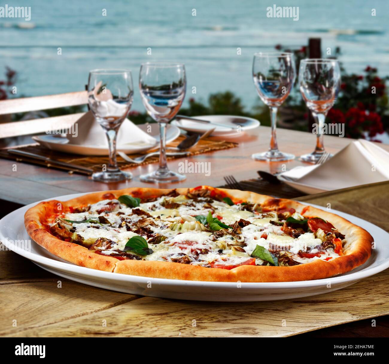 Pizzeria on the beach, pizza food Stock Photo - Alamy