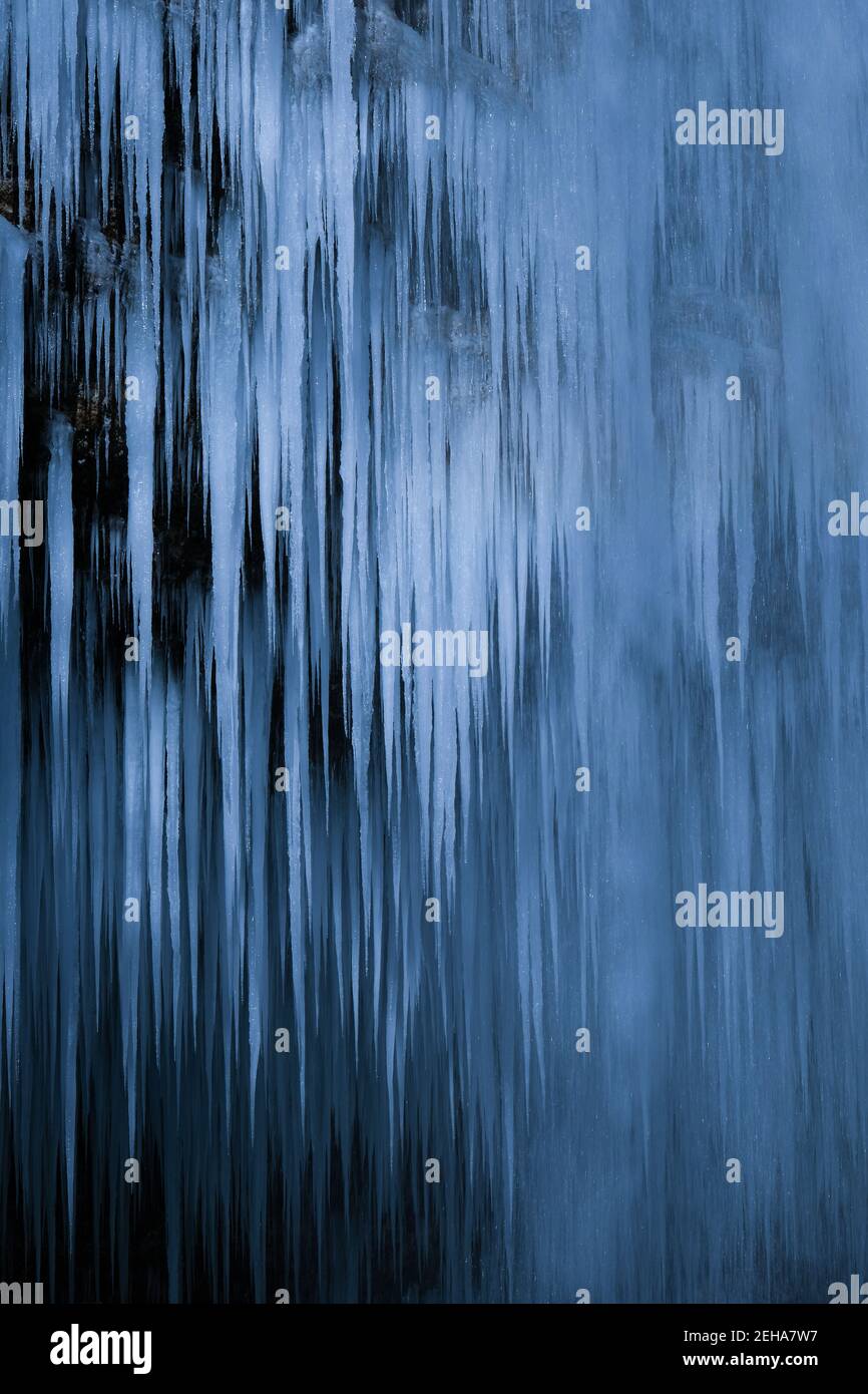 Waterfall crashing down frozen cave hi-res stock photography and images ...