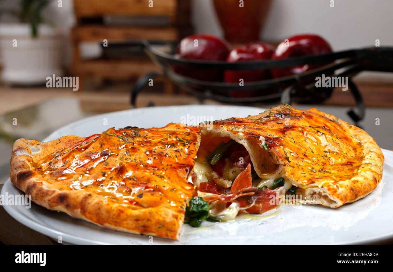 Delicious pizza calzone, Italian food Stock Photo - Alamy