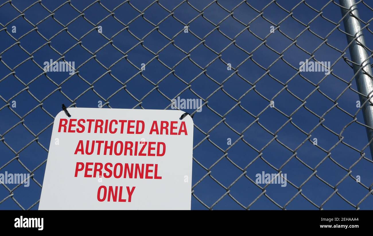 Restricted area, authorized personnel only sign in USA. Red letters ...