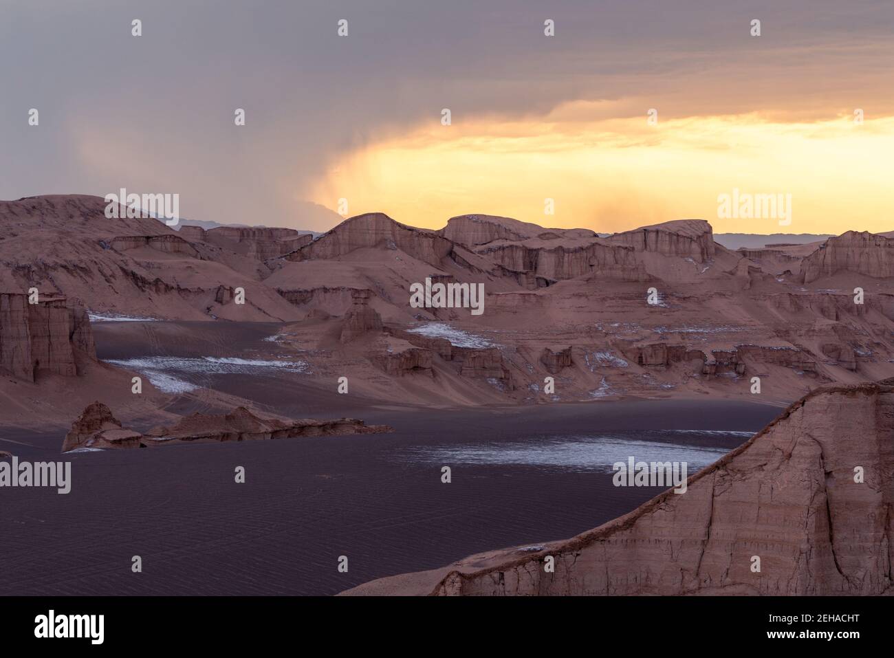 Storm with lots of rain coming to the Lut desert, Iran, in the golden ...