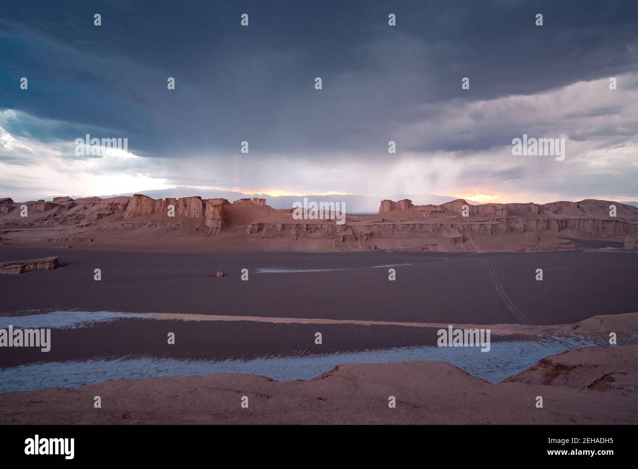 Storm with lots of rain coming to the Lut desert, Iran, in the golden ...